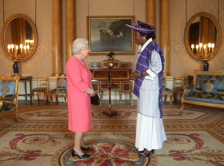 The Queen is pretty in pink as she plays host at Palace - Starts at 60