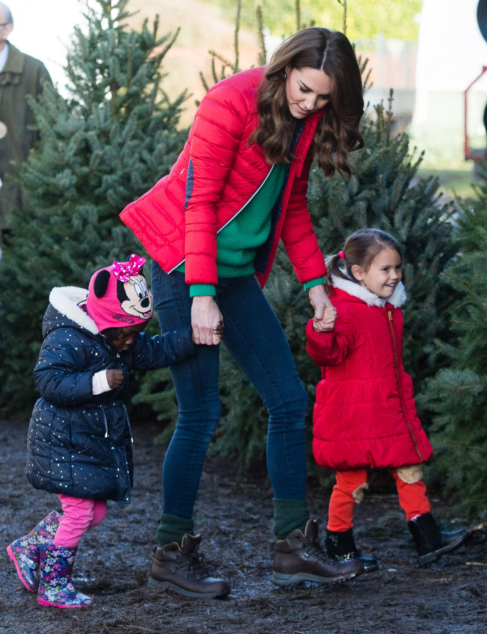 Gorgeous Catherine gets into the Christmas spirit as she rugs up in red ...