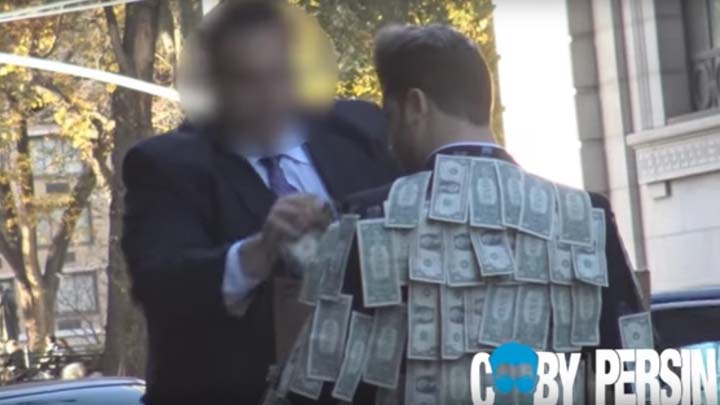 This man taped bank notes to his shirt and held up a sign… What ...