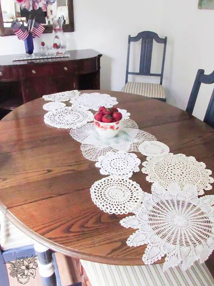 A traditional table runner made of doilies for Christmas - Starts at 60